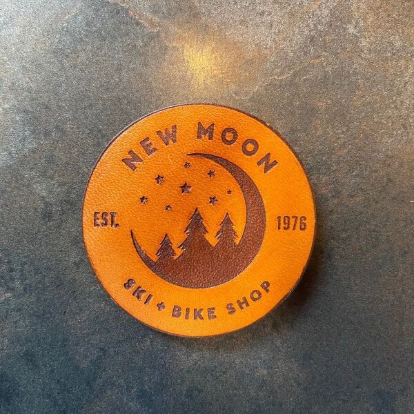 New Moon Logo Leather Magnet by Syd - New Moon Ski & Bike | Hayward, WI